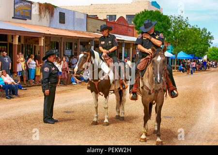 Two Arizona Rangers on horseback ride along E Allen St at the annual ...