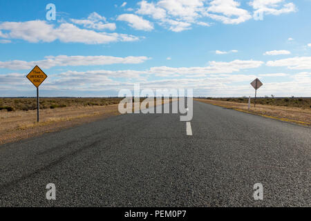 Unfenced road sign in outback Australia Stock Photo - Alamy