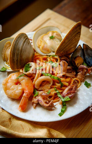 Italian seafood pasta pescatore with clams mussels and squid Stock ...