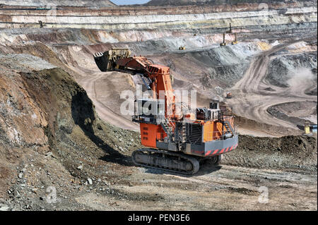 The big dredge digs the earth Stock Photo - Alamy