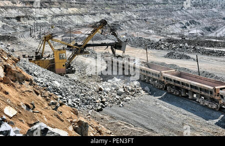 Loading of iron ore on the train in career Stock Photo - Alamy