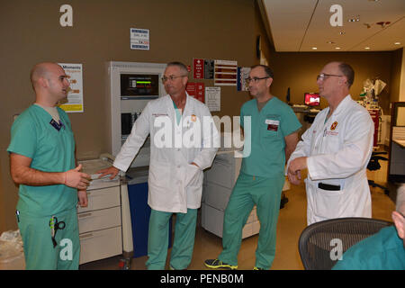 Col. Evan Renz, Brooke Army Medical Center commander, pins the Legion ...