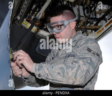 Airman 1st Class Connor Howard removes a bomb fuze initiator (FZU-55 ...