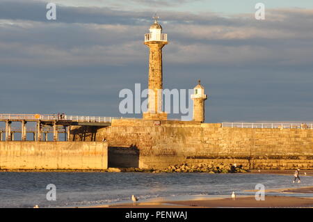 Lighthouses on Whitby harbour entrance with St Mary's Church and Whitby ...