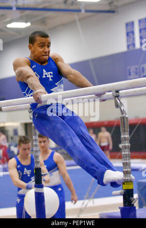 A cadet competes on the still rings during the Rocky Mountain Open ...