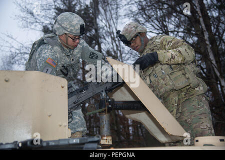 U.S. Soldiers assigned to 554th Military Police Company attach a broken ...