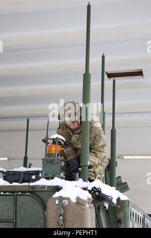 A U.S. Army Soldier installs multiple integrated laser engagement ...