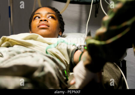 Bundeswehr medical providers at the Role 1 assess Pfc. Katia Blake, U.S ...