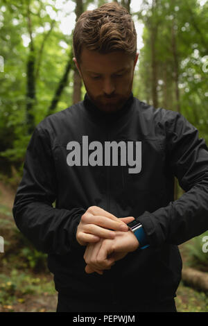 Man in nature using smartwatch app. Close-up hands Stock Photo - Alamy