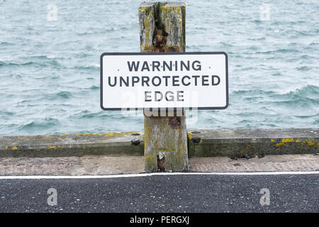 Unprotected edge warning sign at harbour port for car and vehicle ...