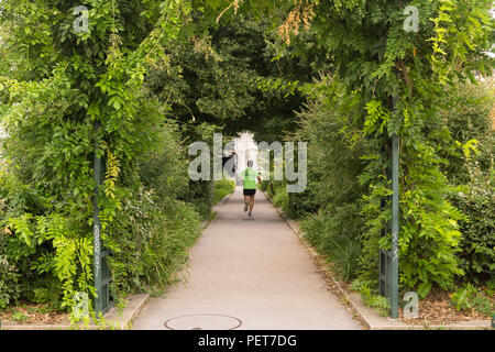 Paris greenery and urban garden - Man walking along the Promenade ...