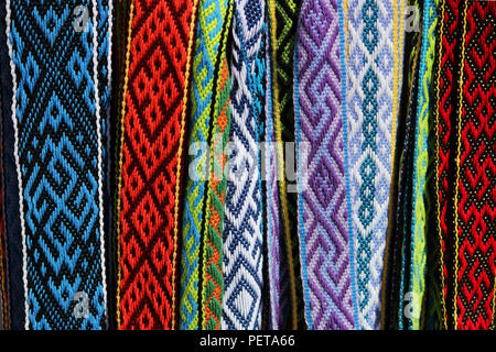 Many colorful belts with patterns. Folk art, handmade, Knitting of a ...