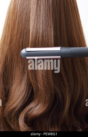 Long colorful hair with objects related to hair salon on close up ...