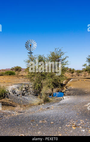 Wind turbine for pumping water, Namibia Stock Photo - Alamy