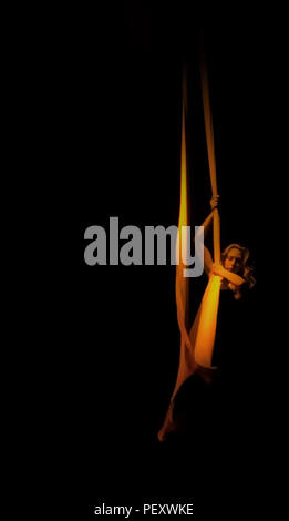 Performance, acrobat and aerial silk with a woman in air for gymnastics ...