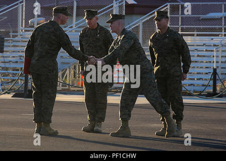 Sgt. Roberto J. Perez, center, stands at attention before receiving the ...