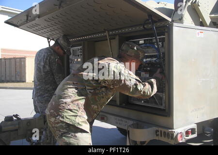 Spc. Brandon McClure (left), a Command Post Node operator, and Sgt ...