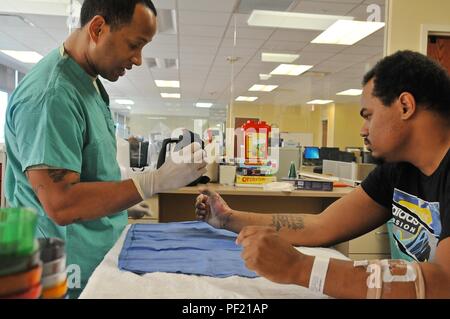 Spc. Kirk Matthews, an Army physical therapist technician with the U.S ...