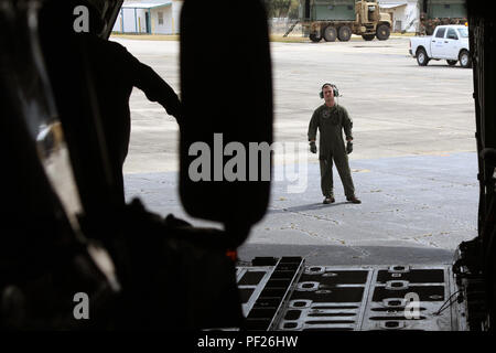 Crew members unload "casualty" from an Army UH-1 Iroquois helicopter in ...
