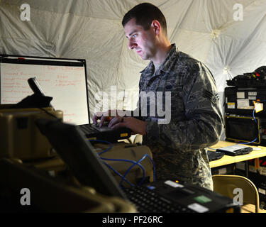 U.S. Airmen with the 52nd Combat Communications Squadron work together ...