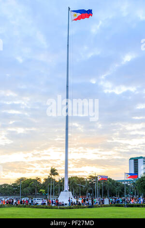 flag of Philippines at luneta, rizal park waving against blue sky ...