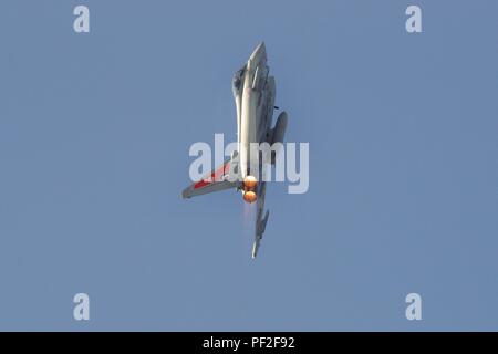 RAF Eurofighter in a steep climb producing vapour on its wings Stock ...