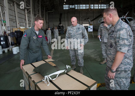 Brig. Gen. Michael Winkler, 5th Air Force vice commander, is briefed by ...