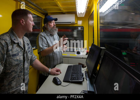 Brig. Gen. Michael Winkler, 5th Air Force vice commander, is briefed by ...