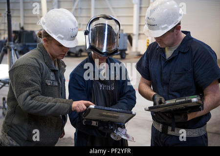 Airmen perform maintenance work on an A-10 Thunderbolt from the 354th ...