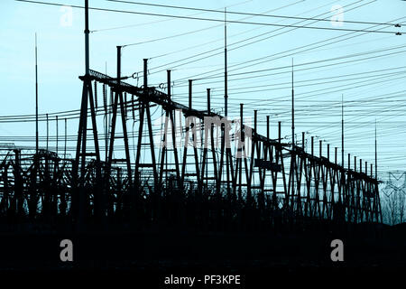 The power supply facilities of contour in the evening Stock Photo - Alamy