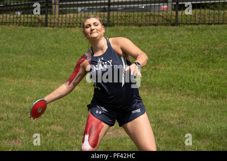 Navy Intelligence Specialist Cassidy Busch demonstrates by throwing a ...