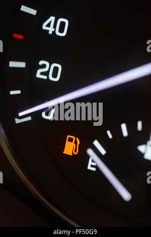 The car dashboard with empty gasoline tank, rev counter and speedometer ...