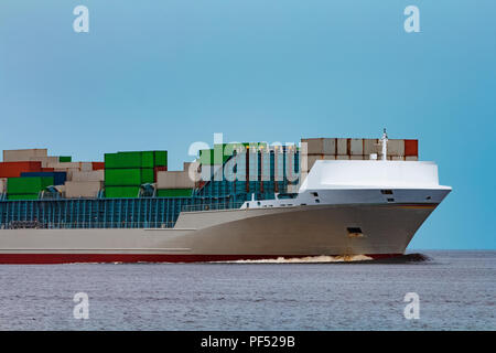 Grey container ship. Logistics and production import Stock Photo - Alamy