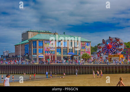 Weymouth Pavilion, beach and fairground ride on a warm sunny day for ...