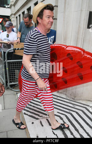Singer Rick Astley arriving in summer beach clothes to perform on Chris ...