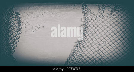 Broken wire mesh fence against blue sky and sea Stock Photo - Alamy