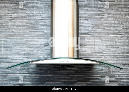 Stainless steel extractor fan above pan on hob in modern kitchen Stock ...