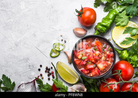 Salsa sauce and ingredients on stone table. Traditional Latin American ...