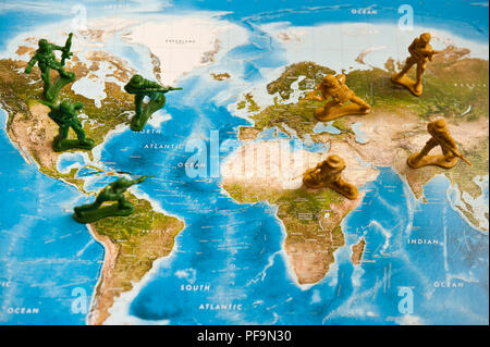 toy plastic soldiers armies facing each other on a world map Stock ...