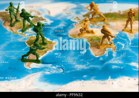 toy plastic soldiers armies facing each other on a world map Stock ...