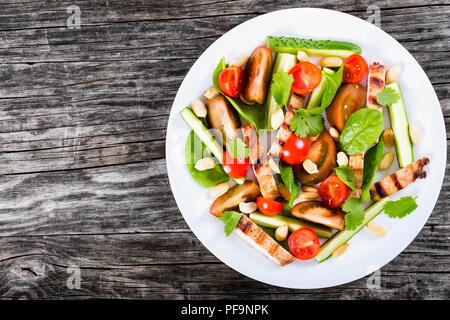 Fresh cucumber salad with roasted peanuts sliced red chili served in ...