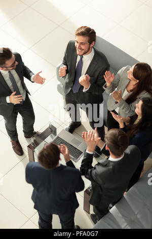 Business team high fiving in the office Stock Photo - Alamy