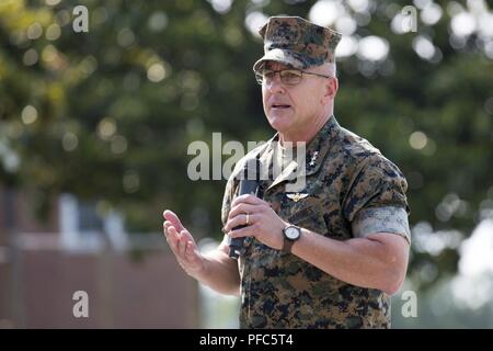 U.S. Marine Corps Col. Jordan Walzer and Col. James Ryan congratulate ...