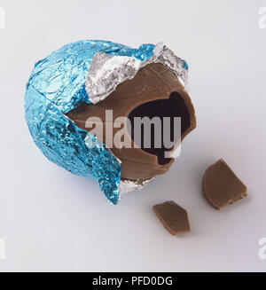 Unwrapped chocolate candy. Close-up. Isolated on white background Stock ...
