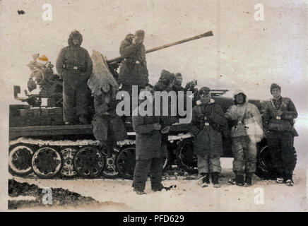 Waffen SS men in Winter Parkas pose in front of their vehicle Kharkov ...