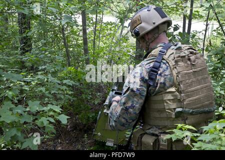 US Navy Personnel pull a line across the flight deck of the Nimitz ...
