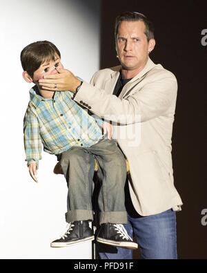 Comedian and ventriloquist entertainer, Ryan, performs on stage with ...