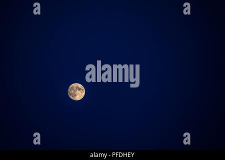 Full moon with visible craters. The big full moon on the dark night ...