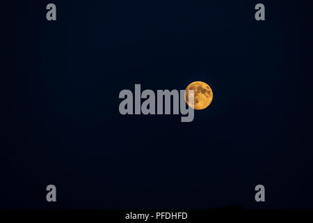 Full moon with visible craters. The big full moon on the dark night ...