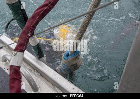 U.S. Navy Diver performs underwater cutting operations using a Broco ...